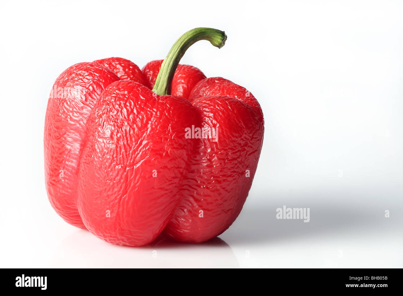 Old wrinkled paprika on white Stock Photo - Alamy