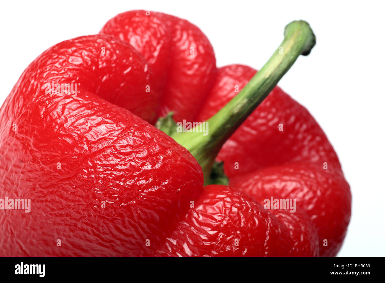 Old wrinkled paprika on white Stock Photo - Alamy