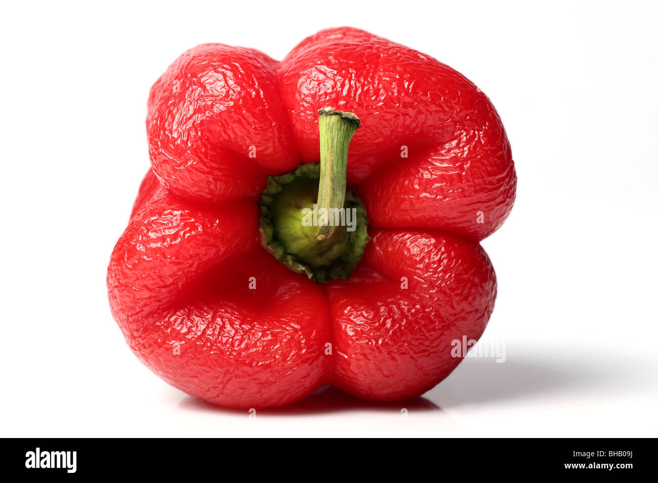 Old wrinkled paprika on white Stock Photo - Alamy