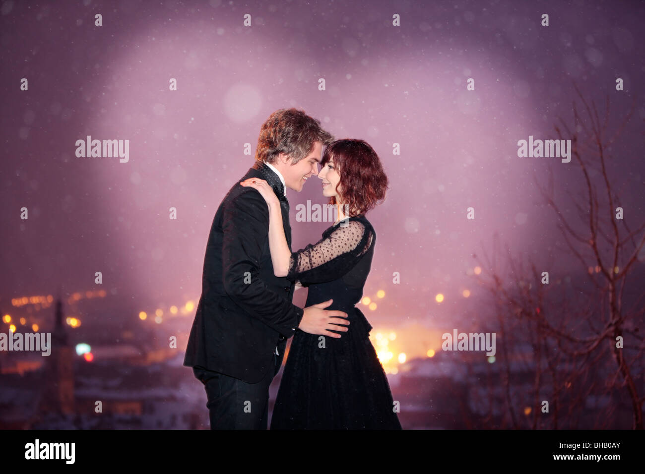 Profile of Romantic Couple smiling looking into each others eyes ...