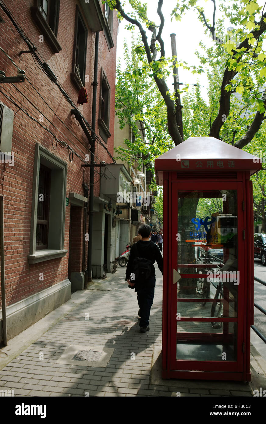 A walk past the red phonebooth in the neighorhood Stock Photo - Alamy