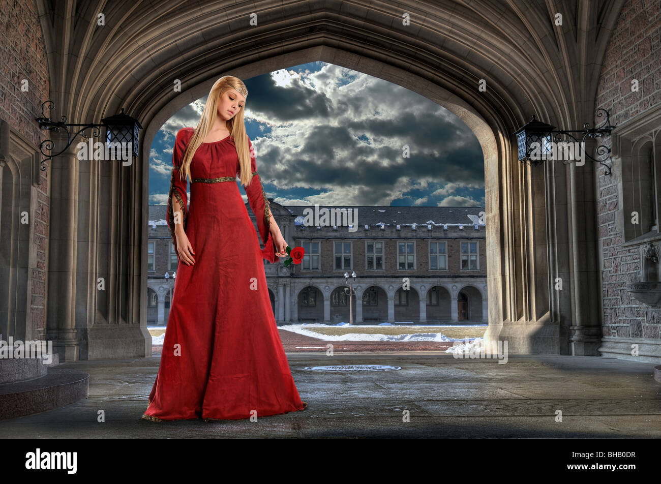 Beautiful Renaissance woman holding rose in ancient building Stock ...