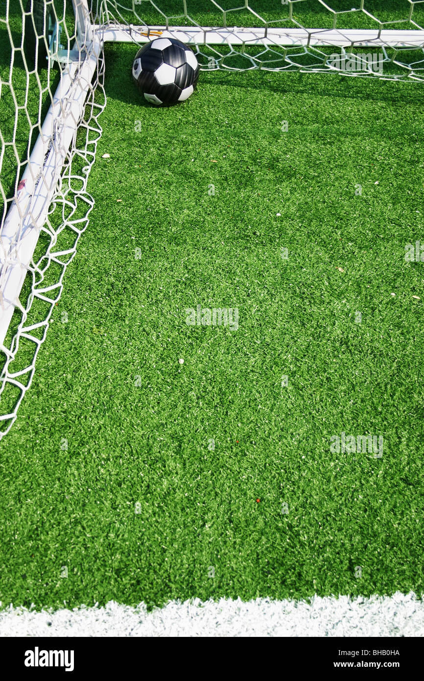 Football in back corner of net after goal Stock Photo - Alamy