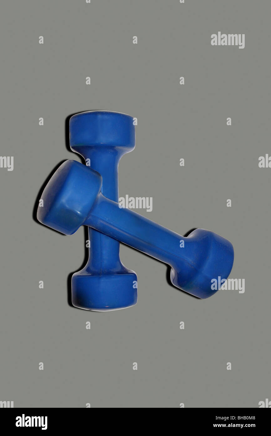 Set of blue free weights on plain background Stock Photo - Alamy