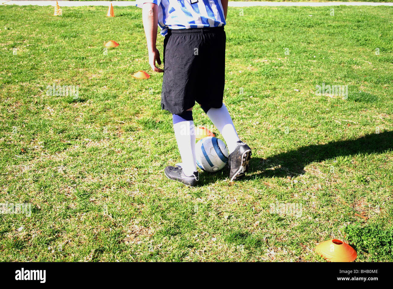 Youth carrying football boots in boot bag Stock Photo - Alamy