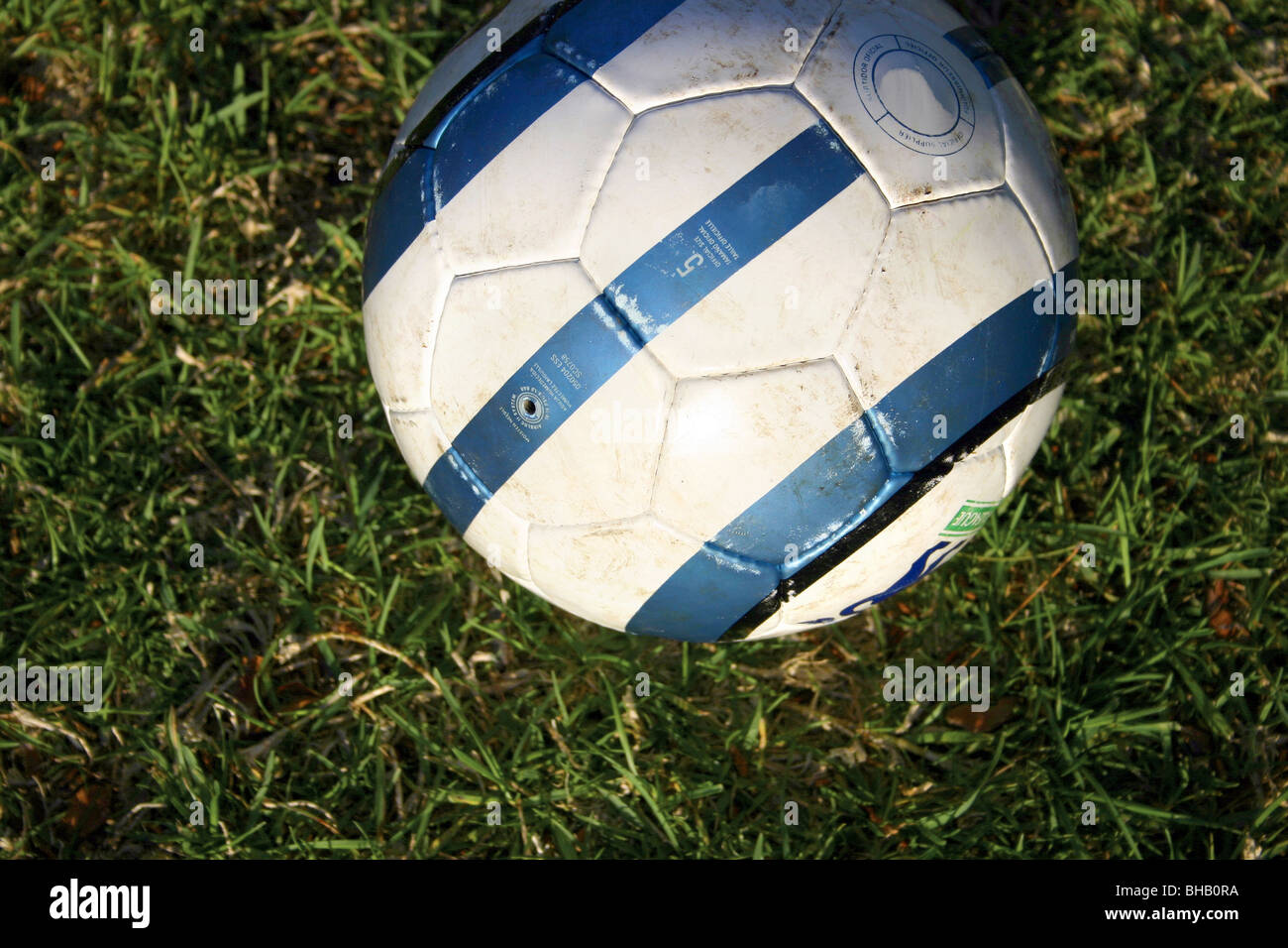 Game football on grass field Stock Photo - Alamy