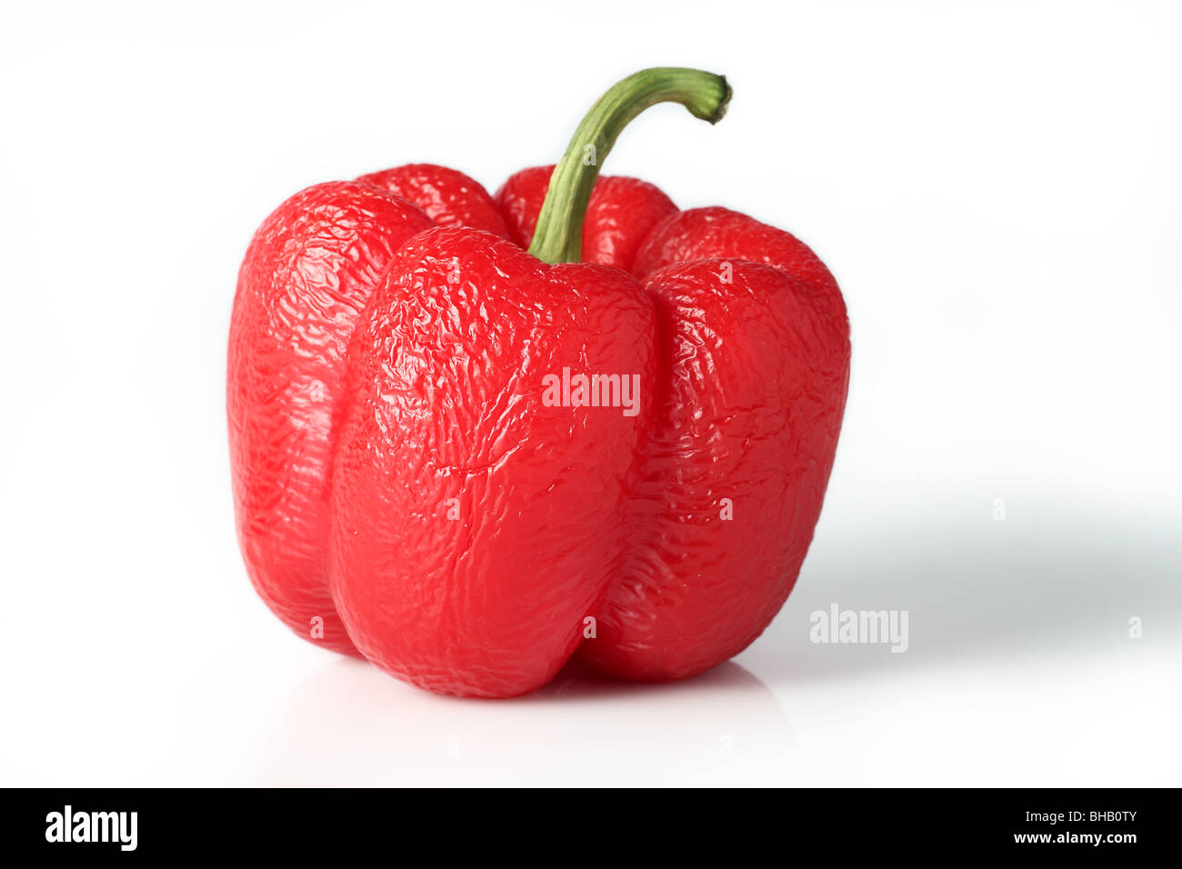 Old wrinkled paprika on white Stock Photo - Alamy