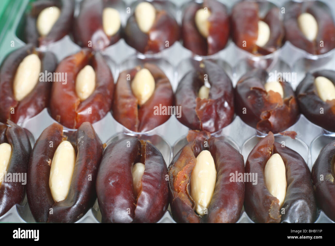 A box of dates that have been pitted and stuffed with almonds, a ...