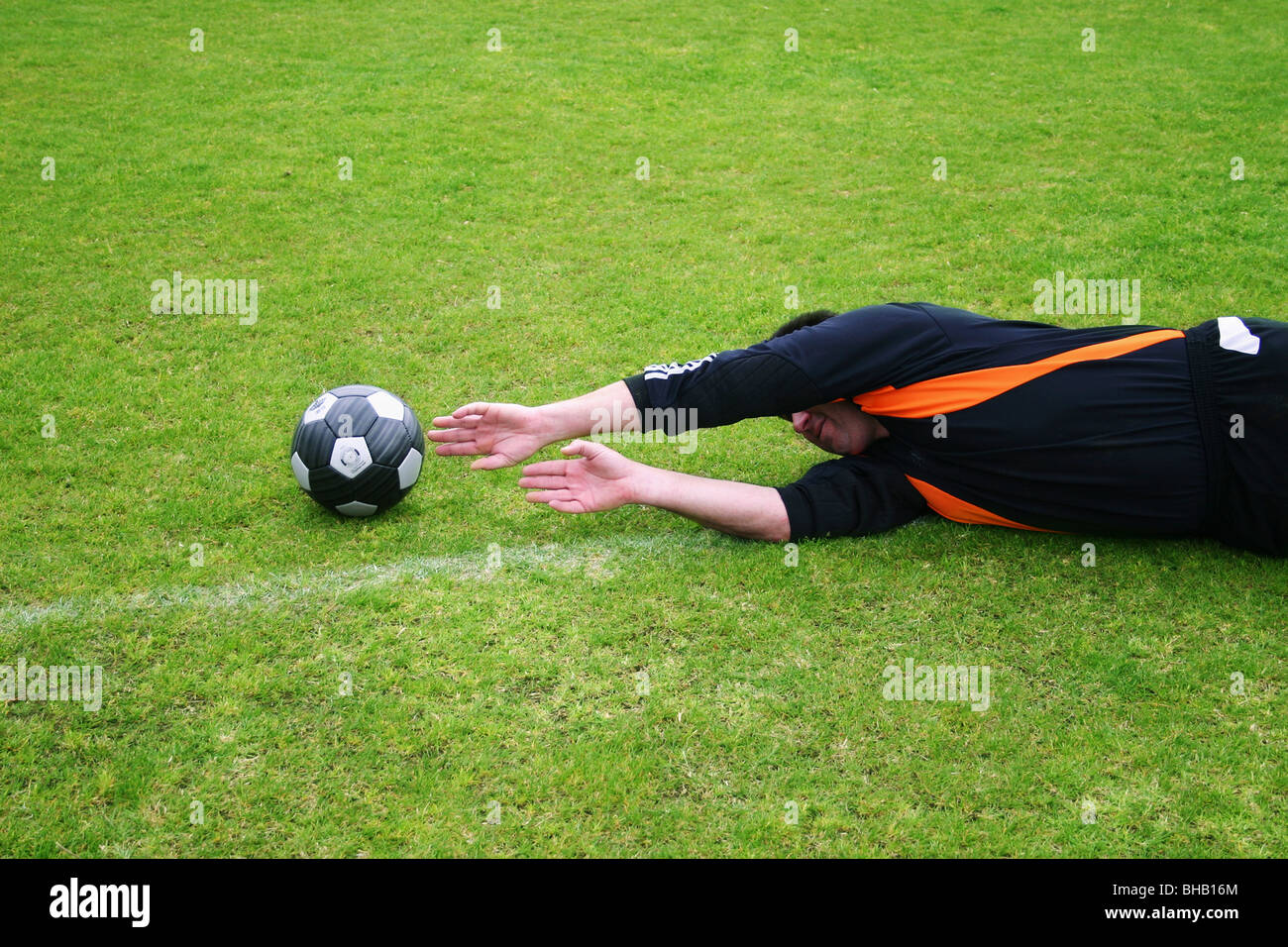 Football dives hi-res stock photography and images - Alamy