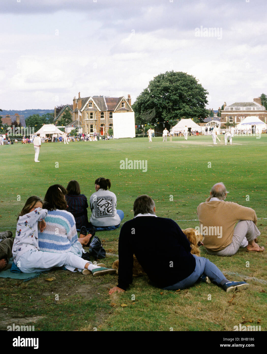 Spectators watching a cricket match Stock Photo - Alamy
