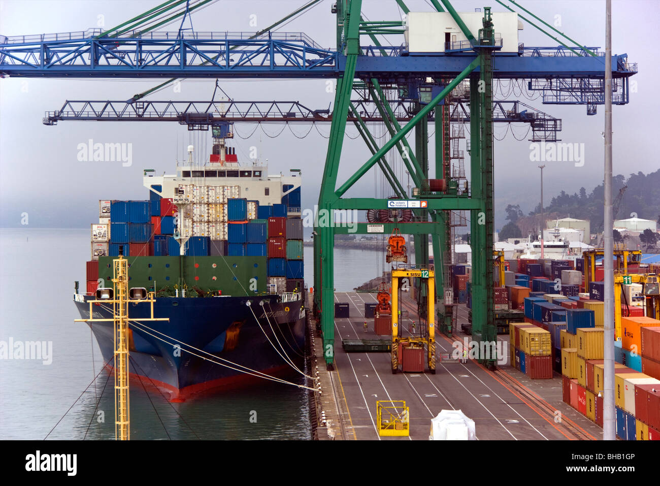 View of container terminal with ship, cranes and container yard at ...