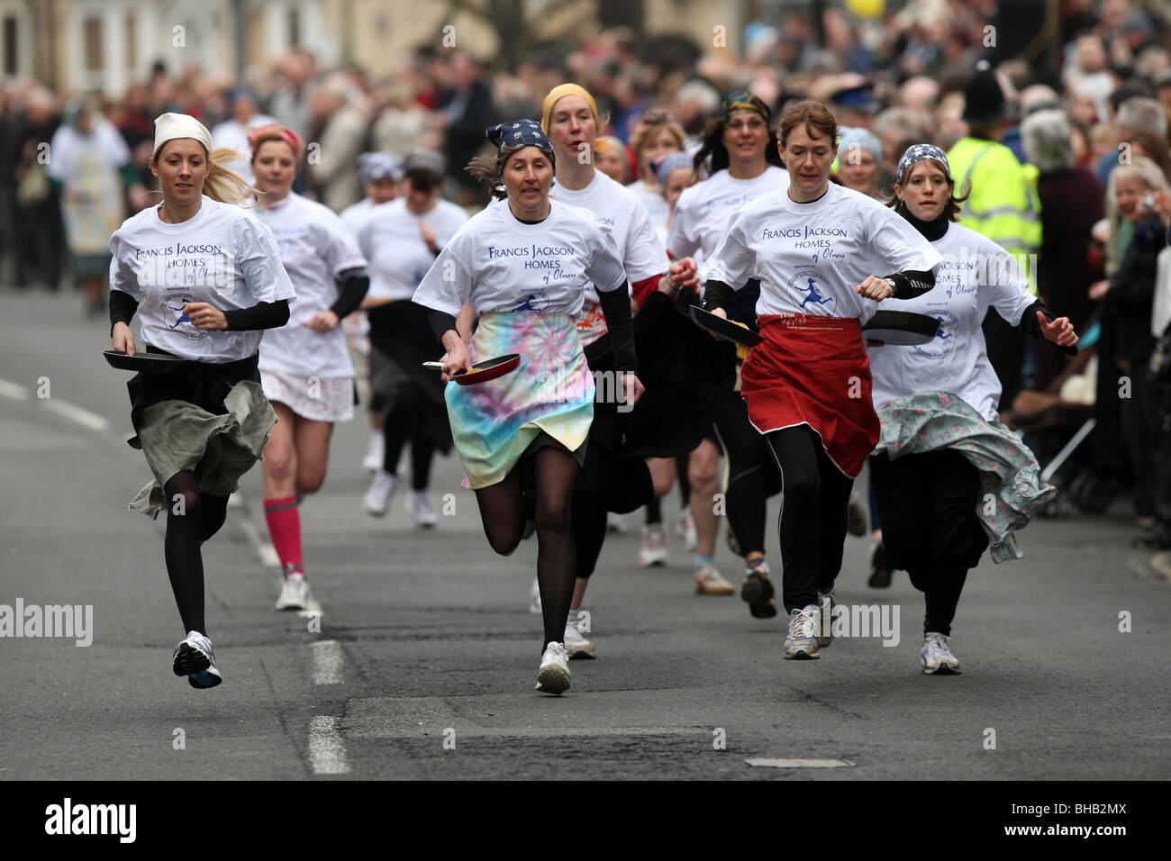 COMPETITORS IN THE WORLDS OLDEST PANCAKE RACE HELD IN OLNEY BUCKS Stock ...