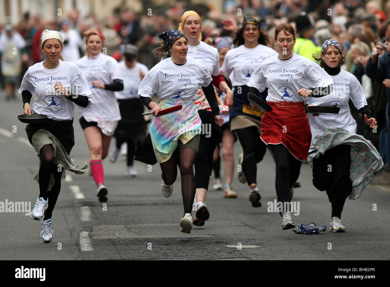 COMPETITORS IN THE WORLDS OLDEST PANCAKE RACE HELD IN OLNEY BUCKS Stock ...