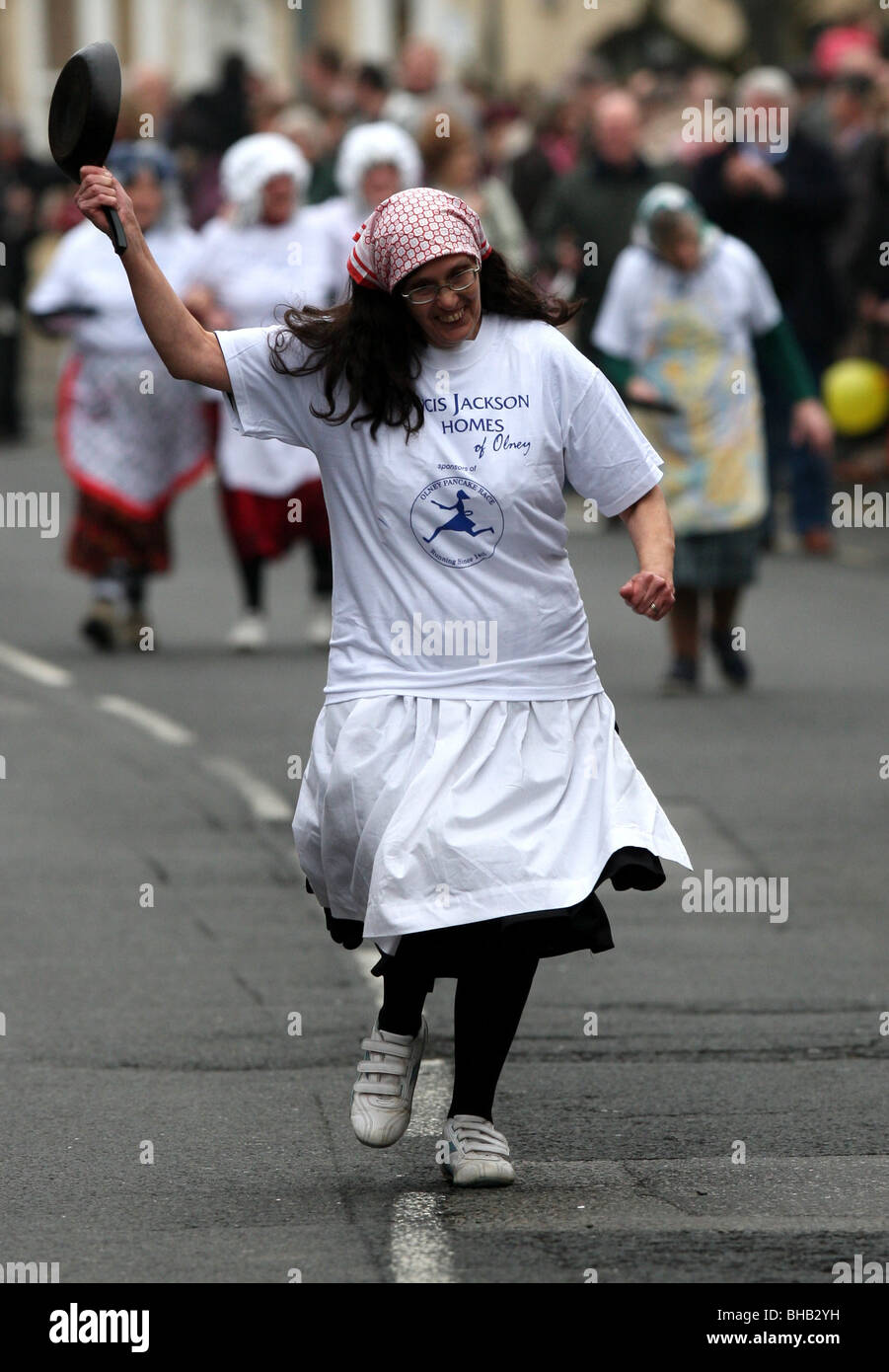 COMPETITORS IN THE WORLDS OLDEST PANCAKE RACE HELD IN OLNEY BUCKS Stock ...