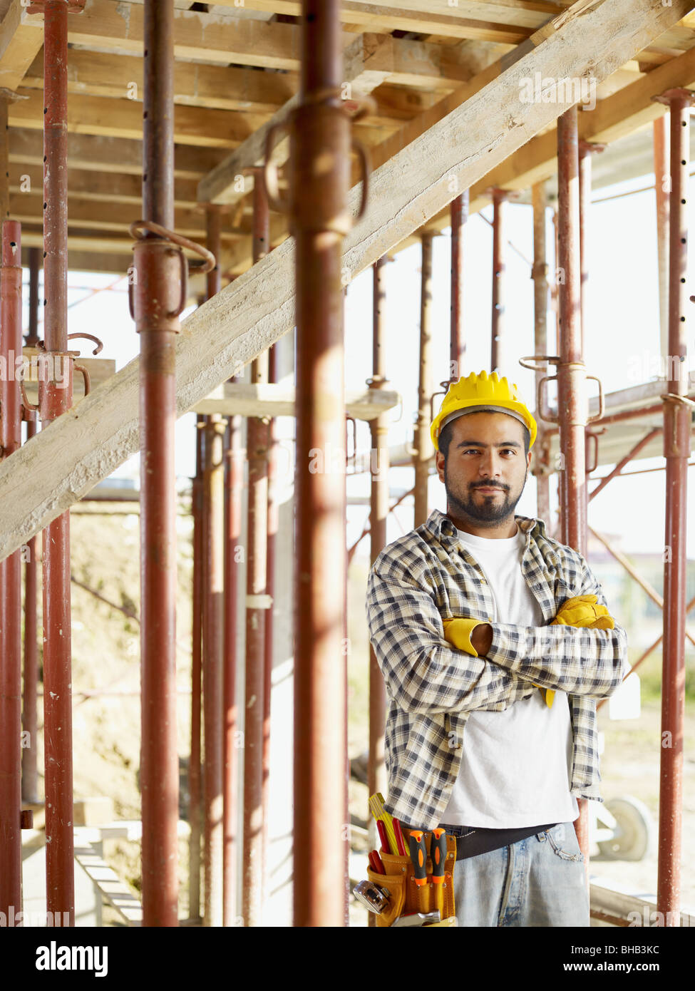 Portrait of latin american construction worker looking at camera with ...