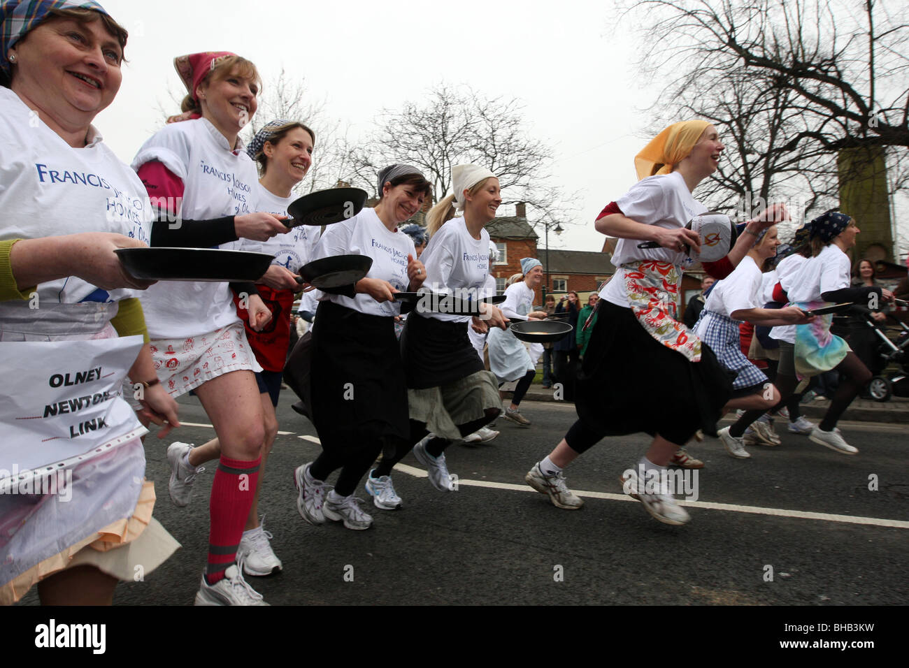 COMPETITORS IN THE WORLDS OLDEST PANCAKE RACE HELD IN OLNEY BUCKS Stock ...