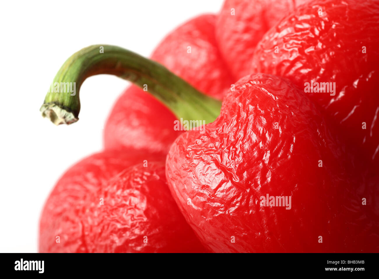 Old wrinkled paprika on white Stock Photo - Alamy