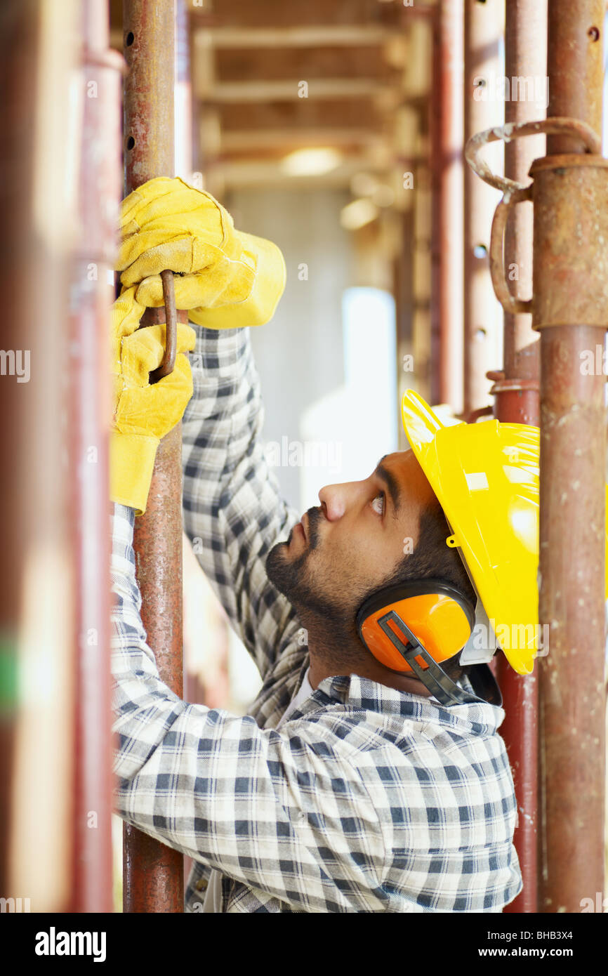 construction worker fixing girder Stock Photo - Alamy
