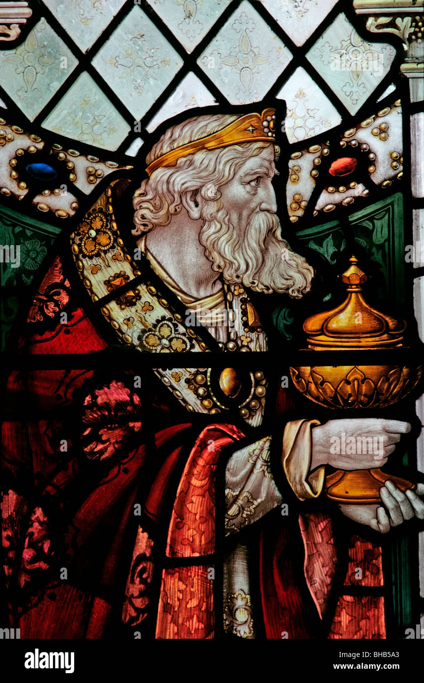 A stained glass window depicting one of the Magi bringing offerings to ...