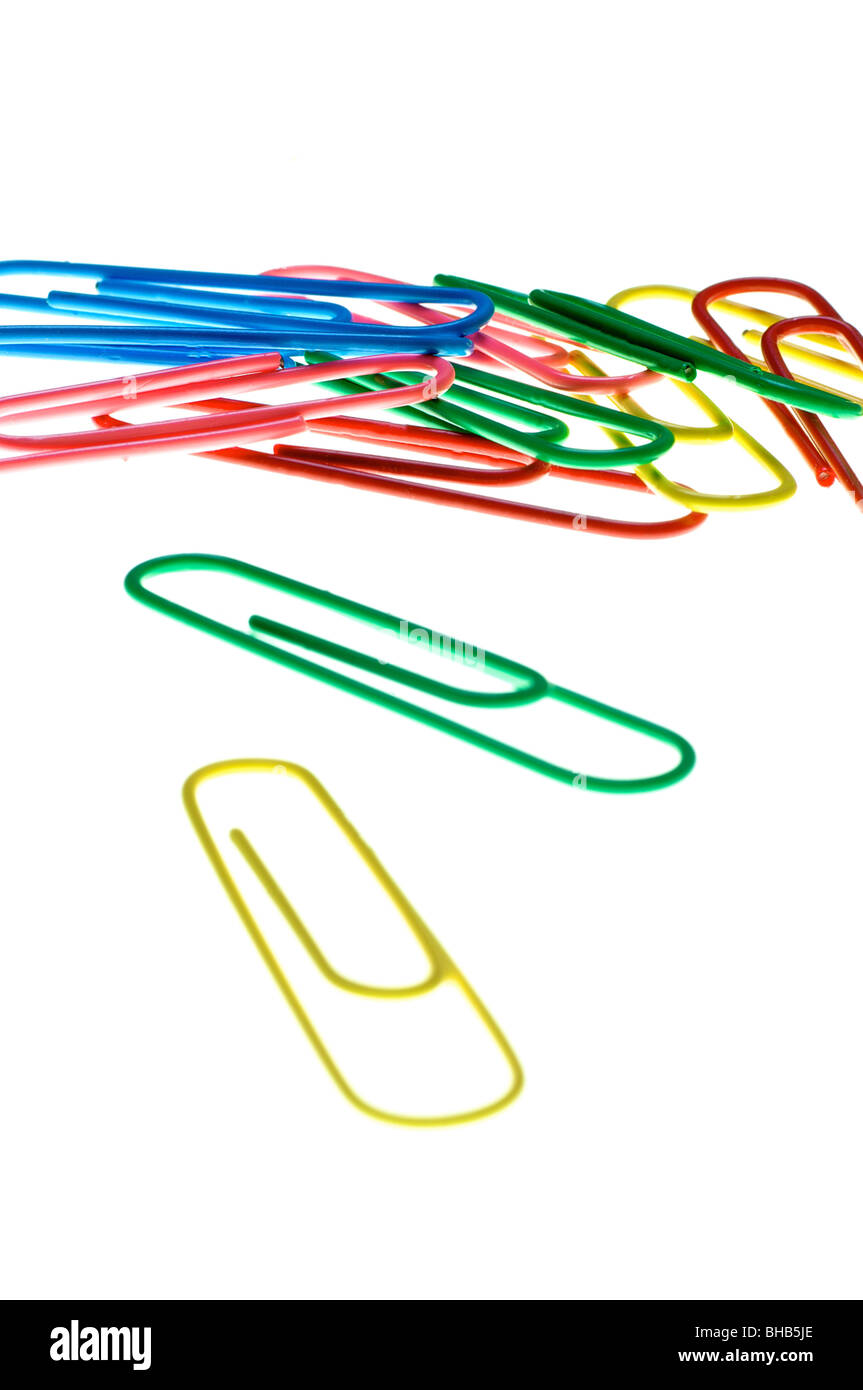 Paper clips on white background Stock Photo - Alamy