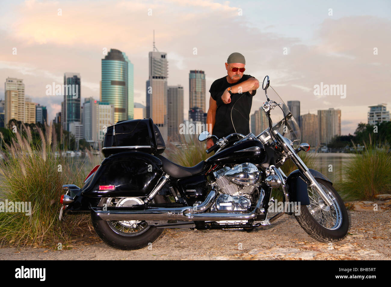 Bike rider with a city background Stock Photo - Alamy