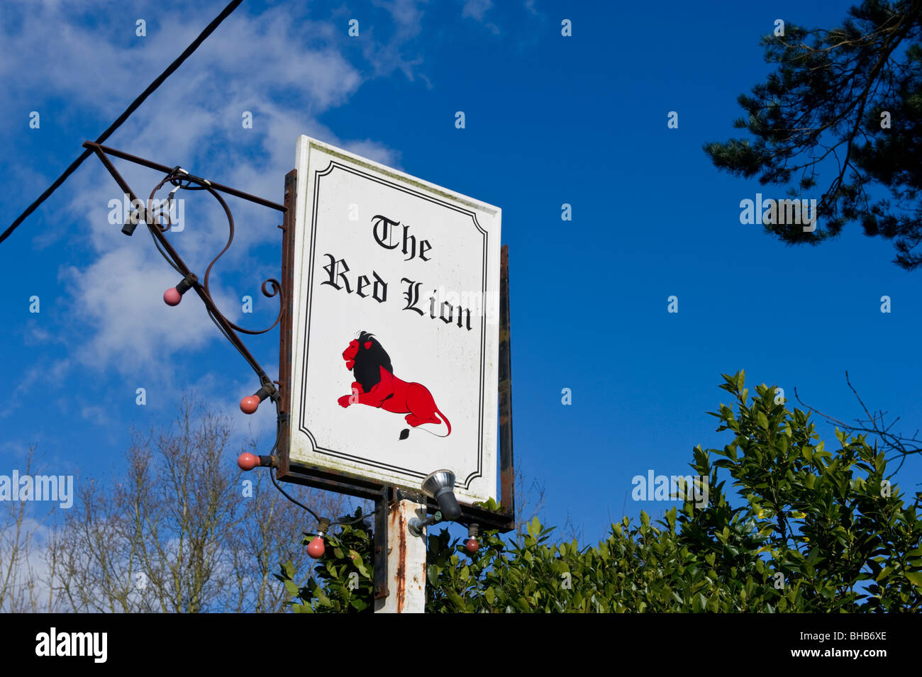 Red Lion pub sign against a blue sky at Coleshill Buckinghamshire UK ...