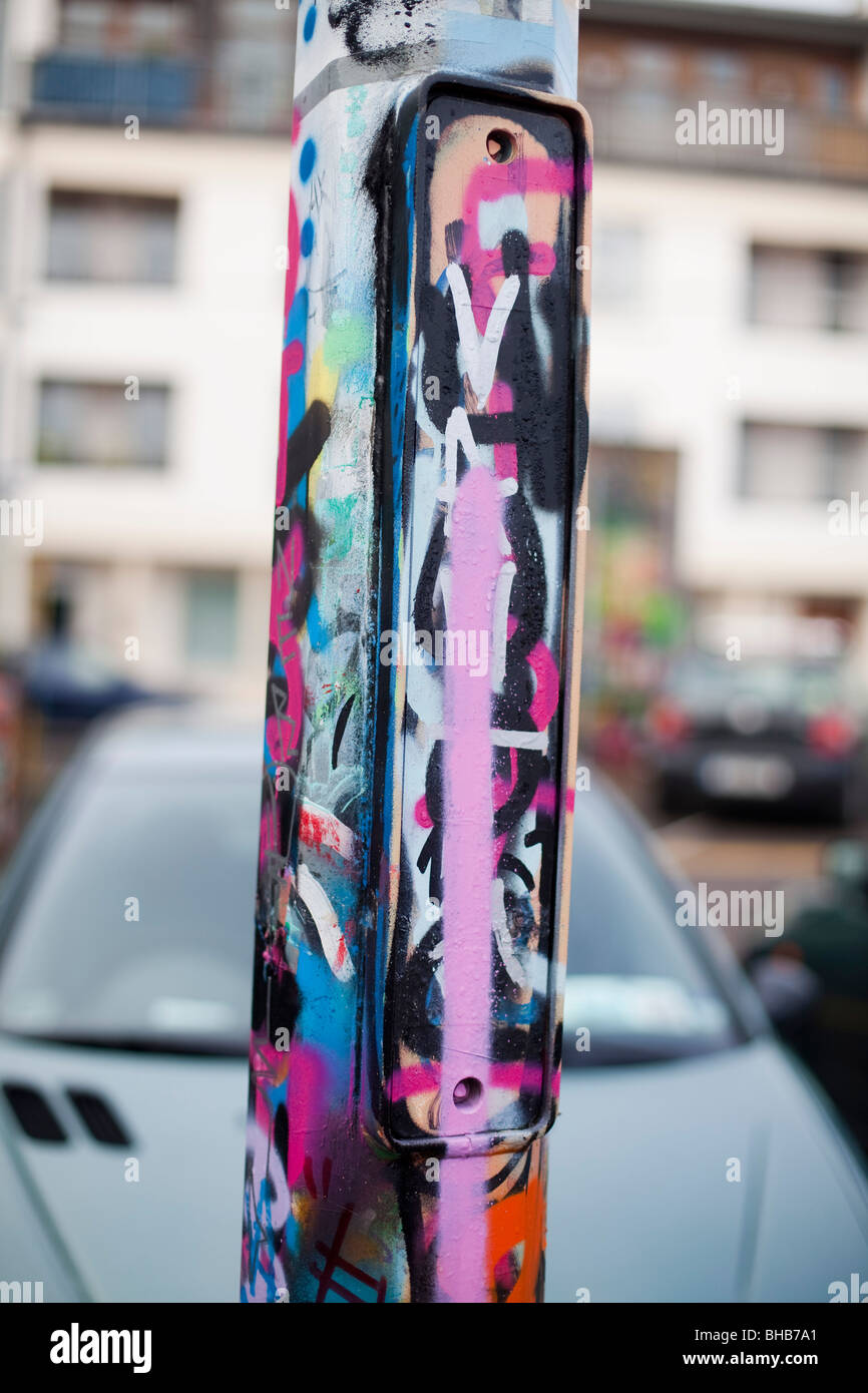 Street lamp spray painted in a graffiti park in an urban setting in a ...