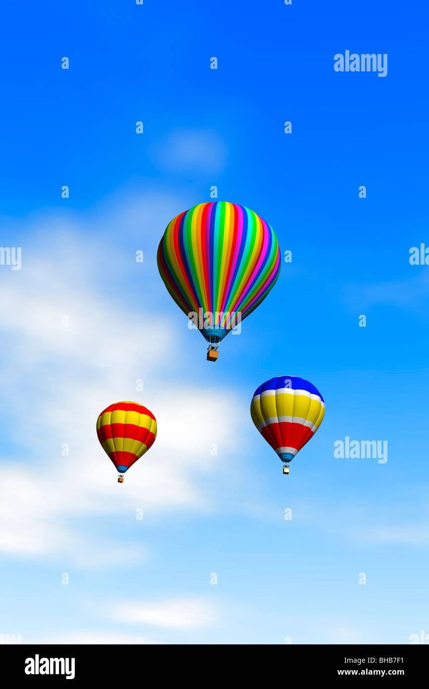 Three hot air balloons flying mid-air Stock Photo - Alamy