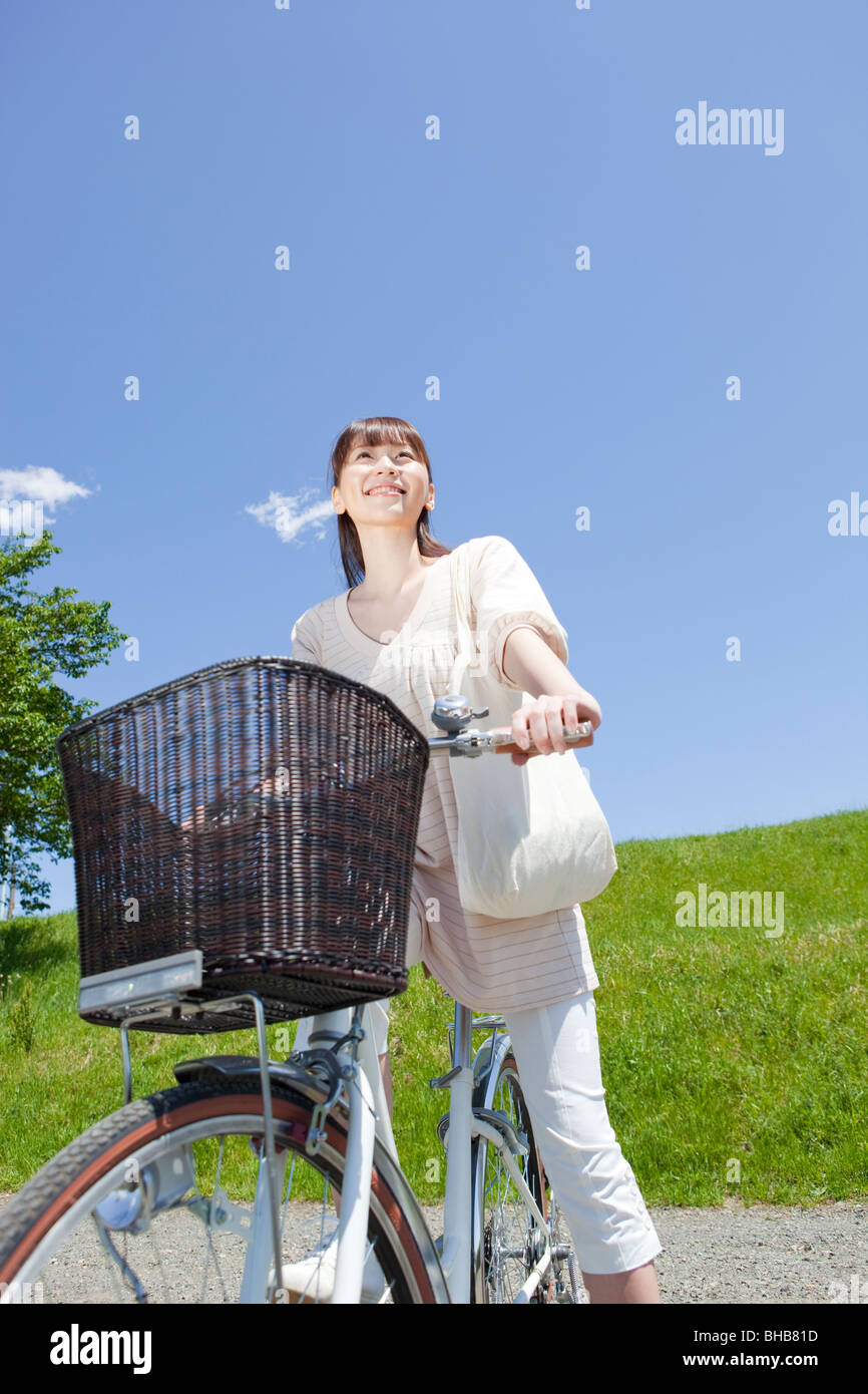 Japanese woman on bicycle hi-res stock photography and images - Alamy
