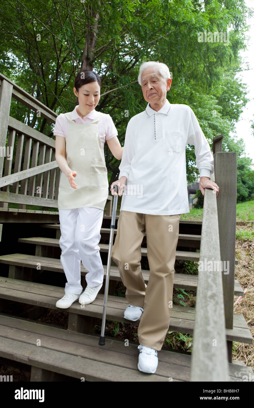 Nurse walking down steps hi-res stock photography and images - Alamy
