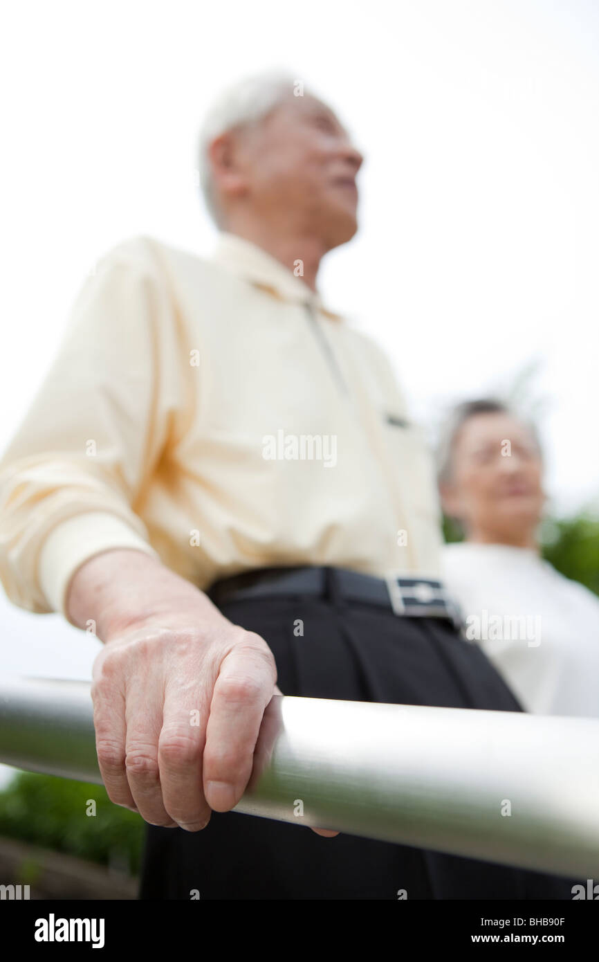 Japan, Tokyo Prefecture, Senior man's hand holding railings, focus on ...