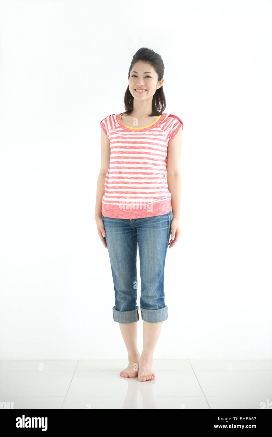 Japan, Osaka Prefecture, Young woman smiling, portrait Stock Photo - Alamy