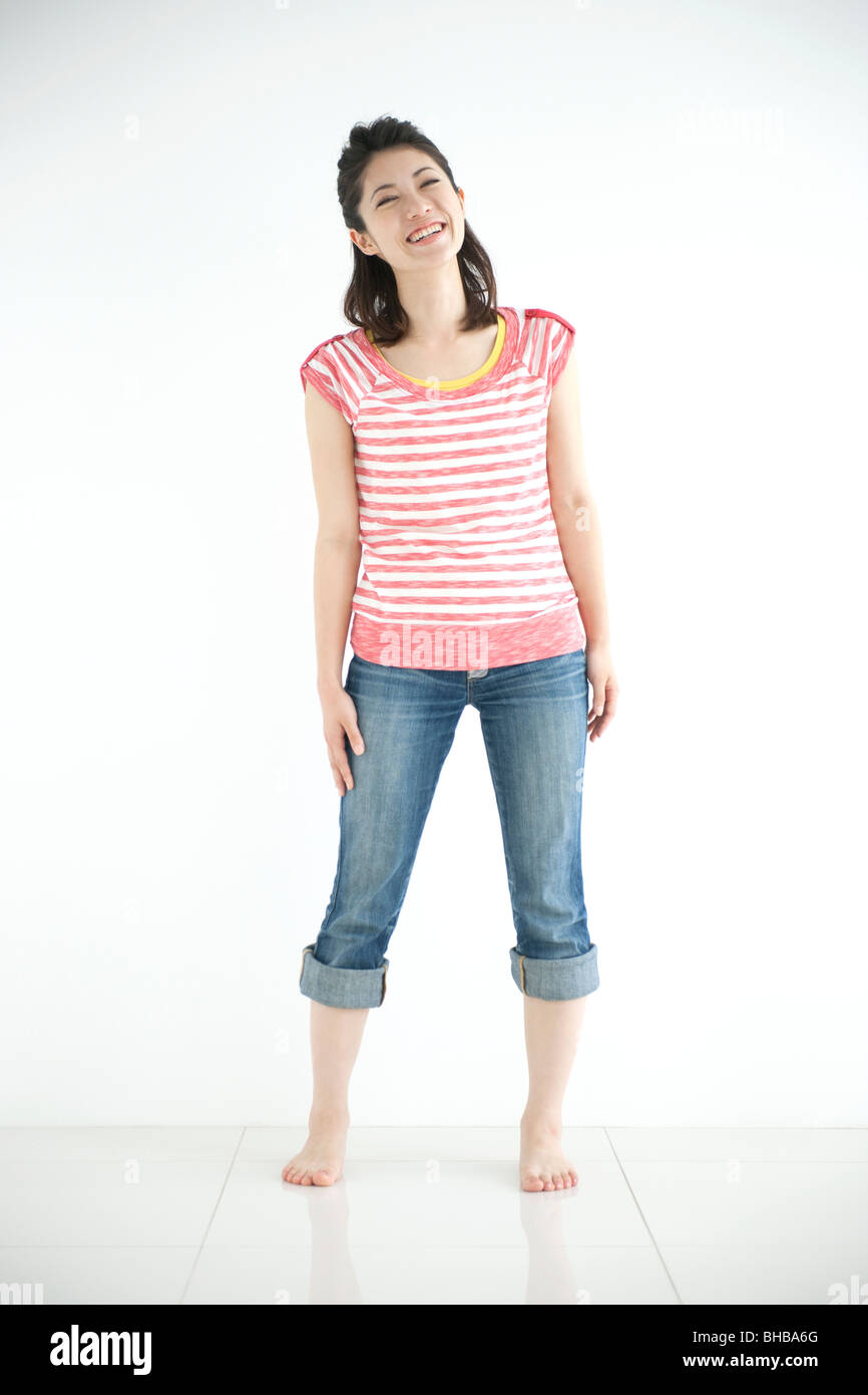 Japan, Osaka Prefecture, Young woman smiling, portrait Stock Photo - Alamy