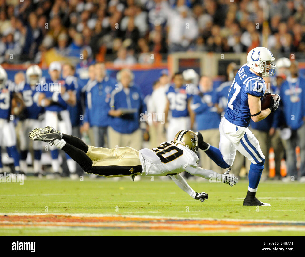 Austin Collie #17 of the Indianapolis Colts runs with the ball as ...