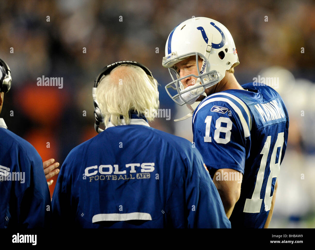 Peyton Manning #18 of the Indianapolis Colts talks with assistant coach ...