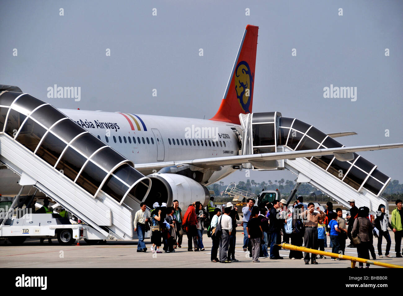 passengers walking from an Airbus A321 parked on the tarmac after ...