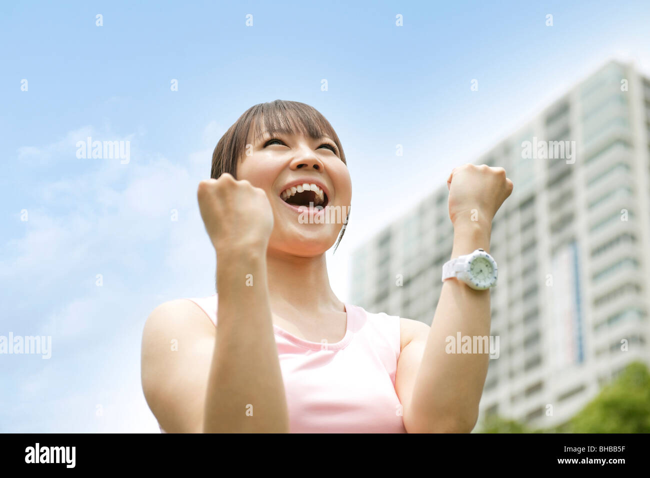 Hand raised standing cheering building exterior hi-res stock ...