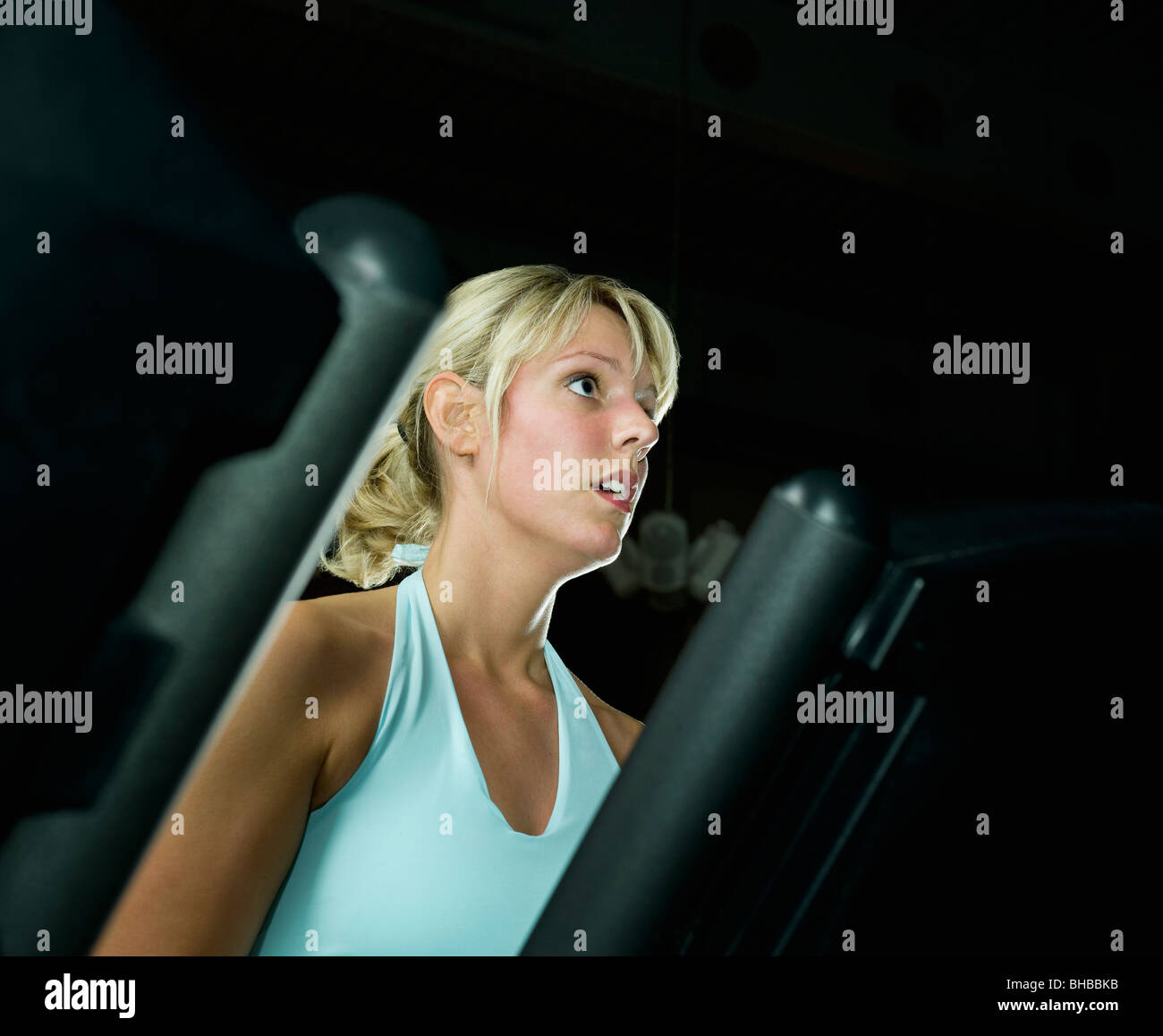 A woman on a running machine Stock Photo - Alamy