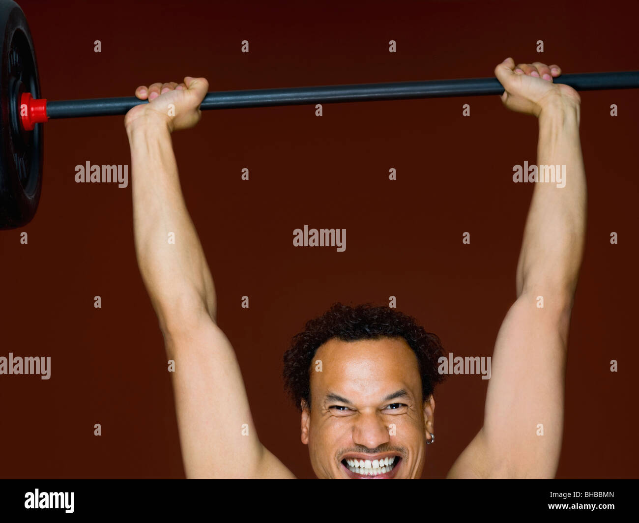 A male working out using weights Stock Photo - Alamy