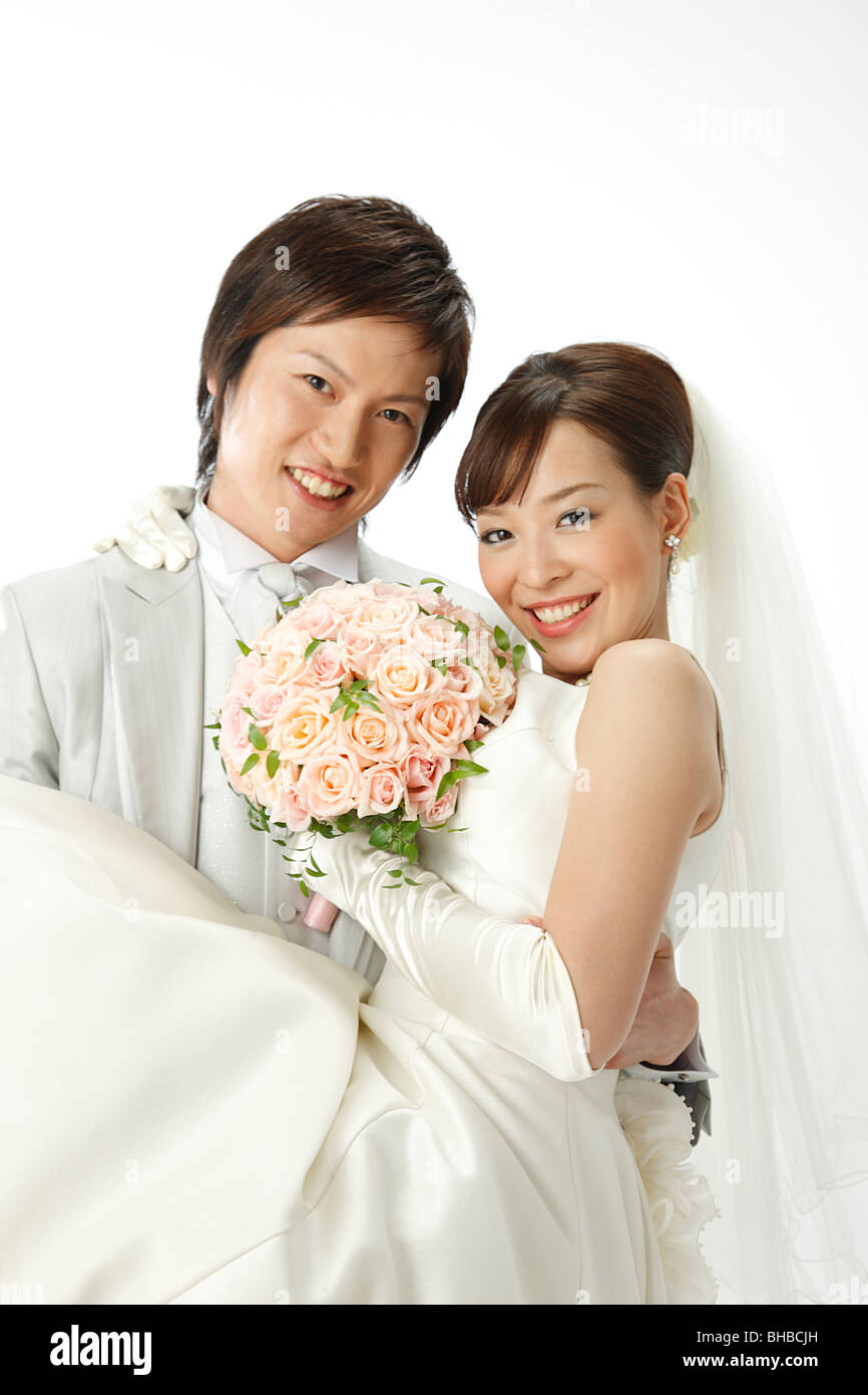 Bridegroom carrying bride hi-res stock photography and images - Alamy