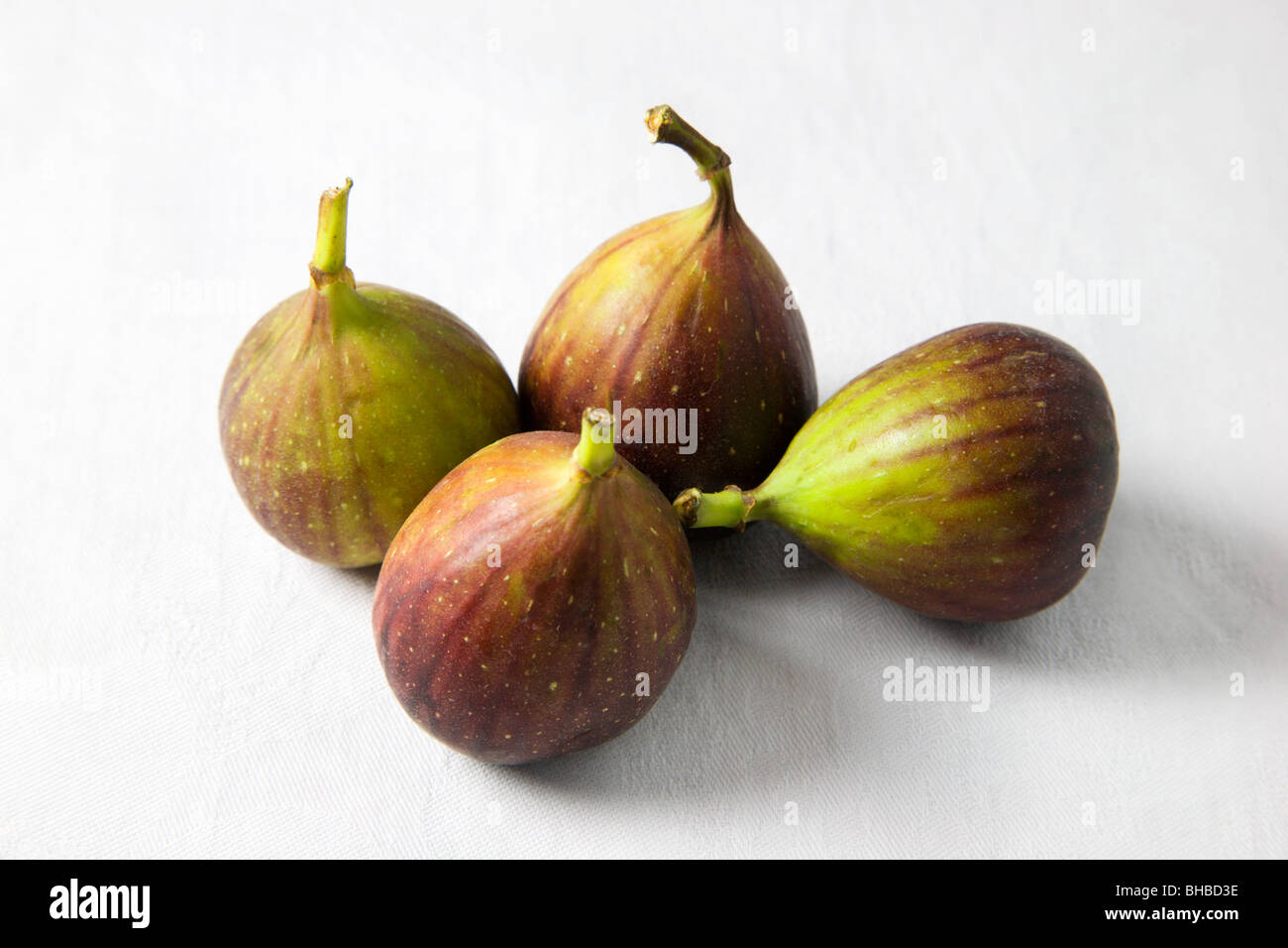 Four Fresh Figs on a White Background Stock Photo - Alamy