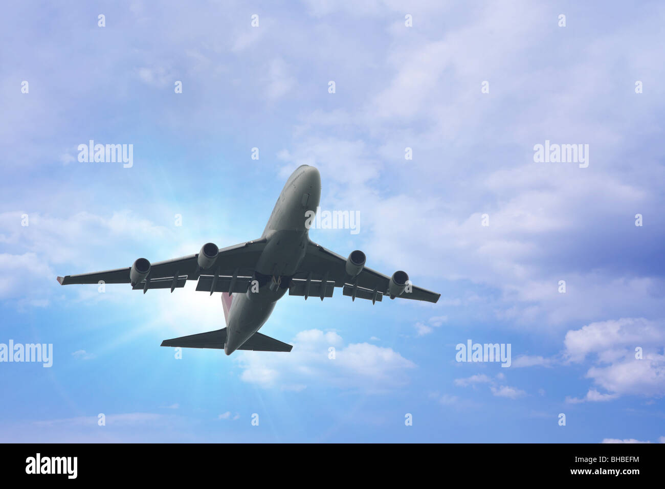 Commercial airplane in flight, low angle view Stock Photo - Alamy