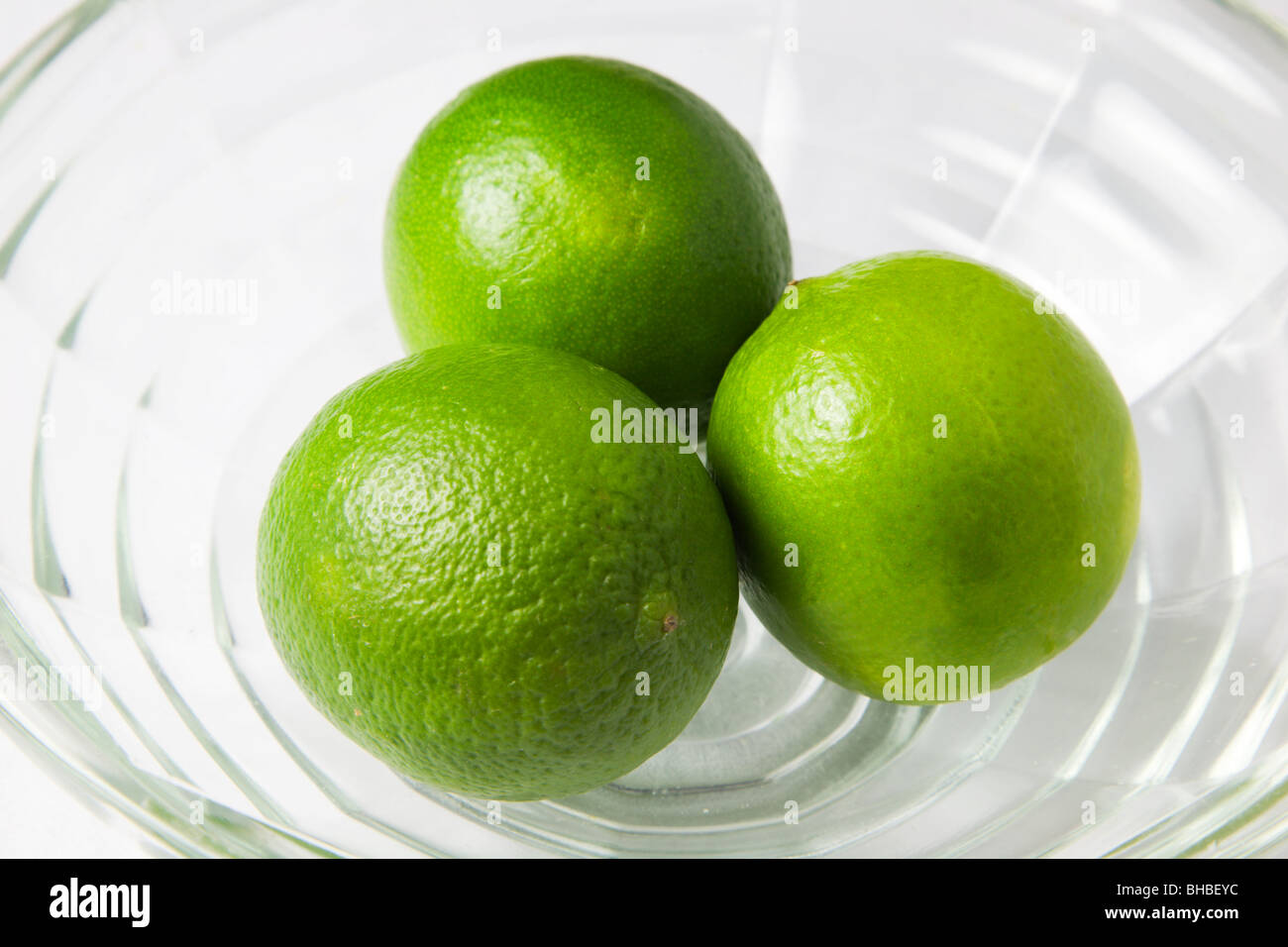 Three limes in a white dish hi-res stock photography and images - Alamy
