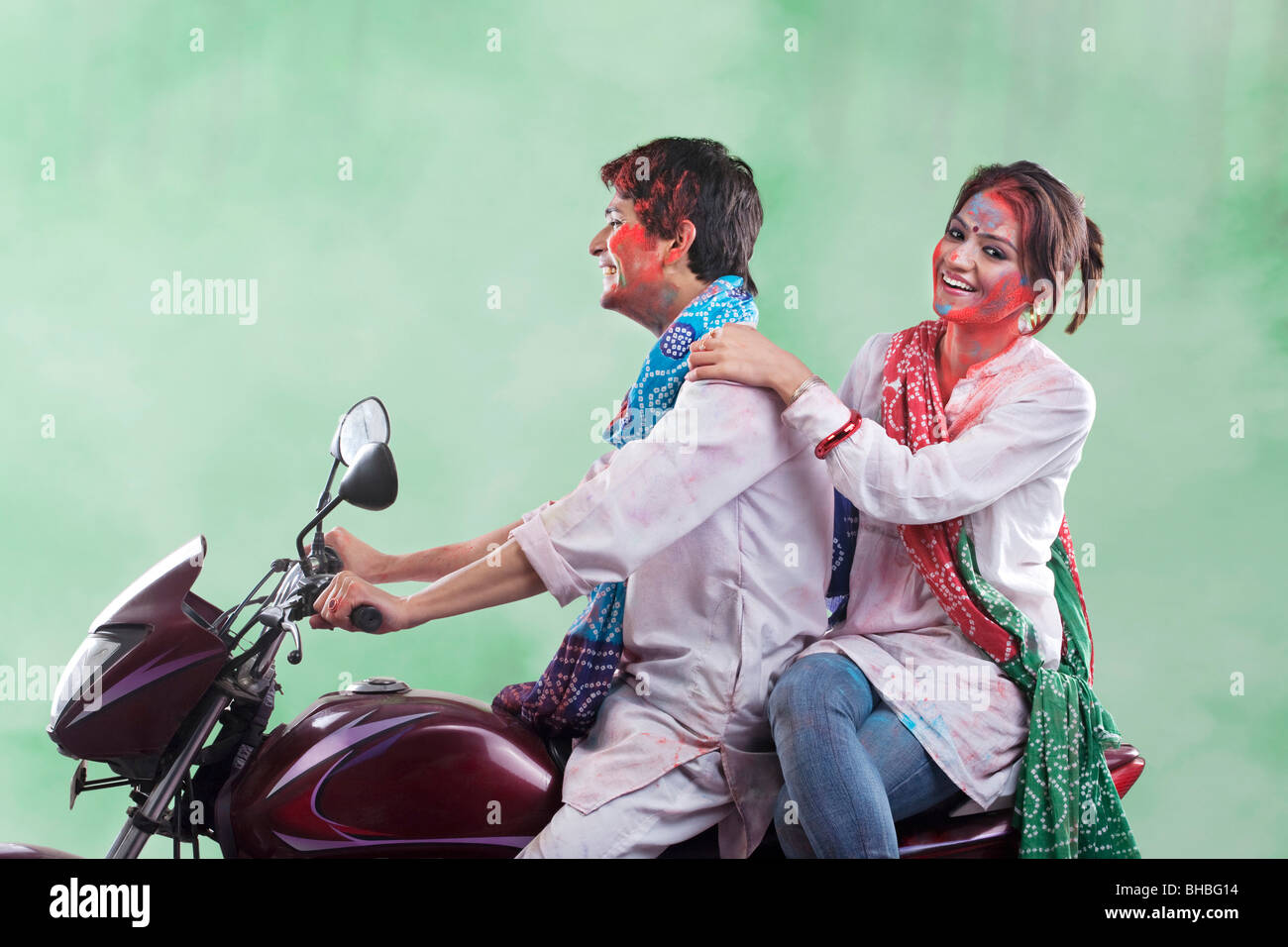 Couple riding on a motorcycle Stock Photo - Alamy
