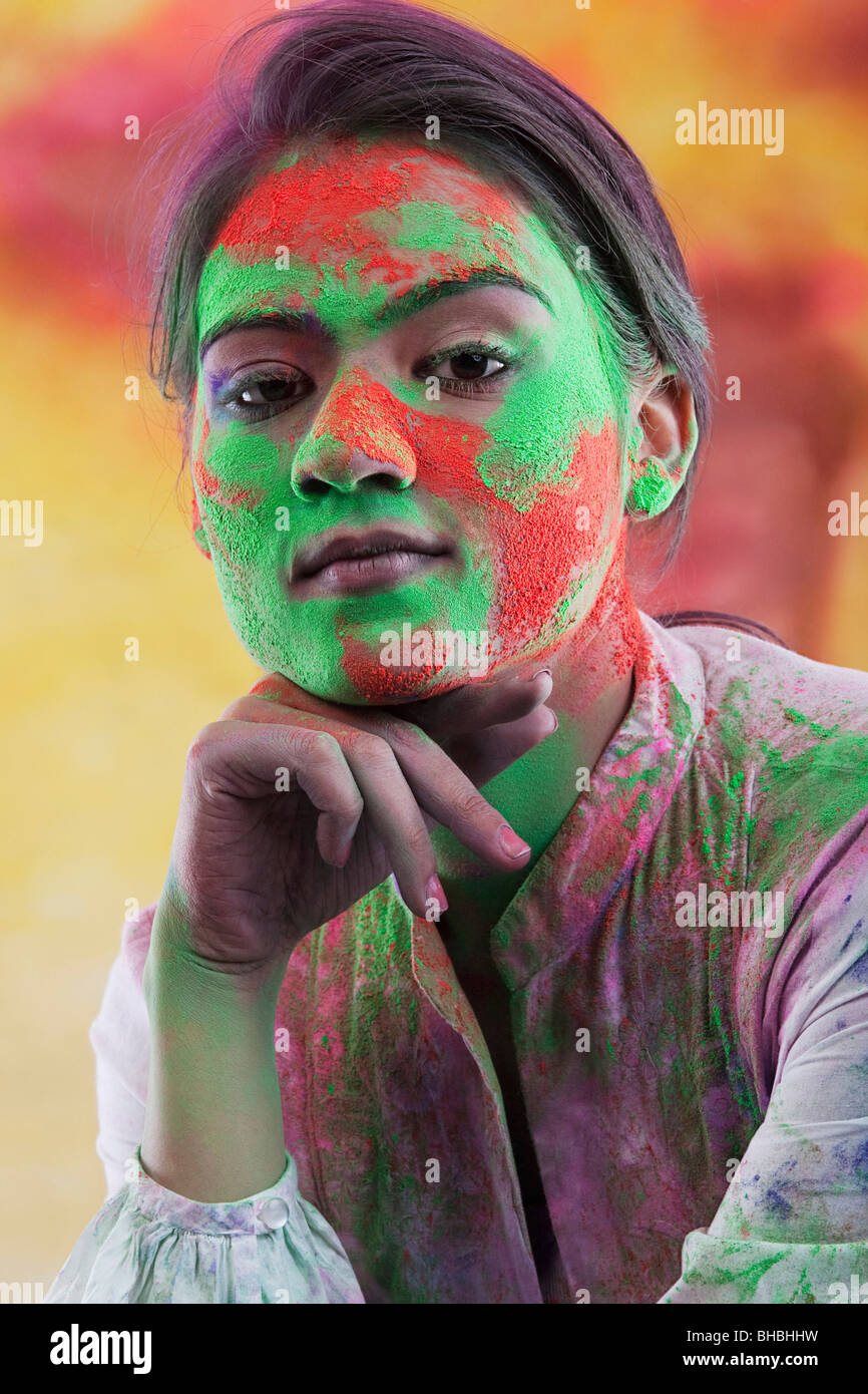 Woman's face covered in holi colours Stock Photo - Alamy