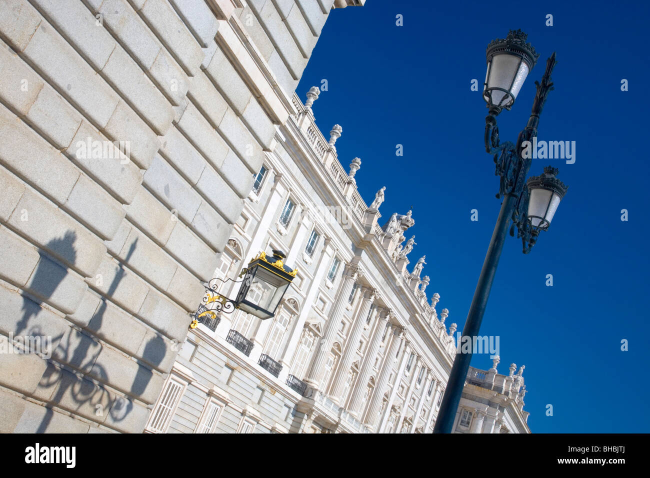 Madrid, Spain. East façade of the Palacio Real, lamp-post in foreground ...