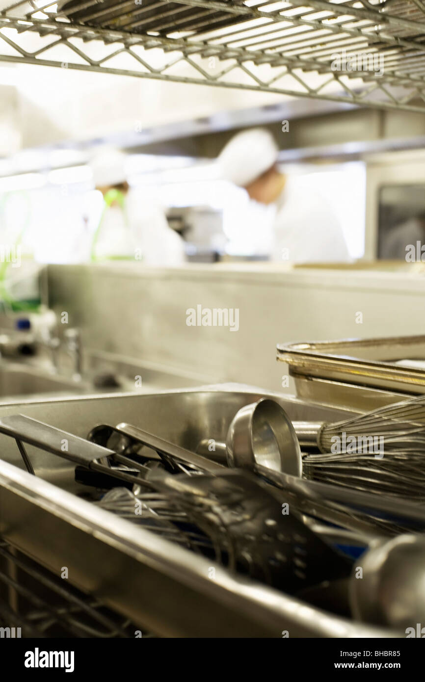 Chefs at work in a kitchen Stock Photo - Alamy