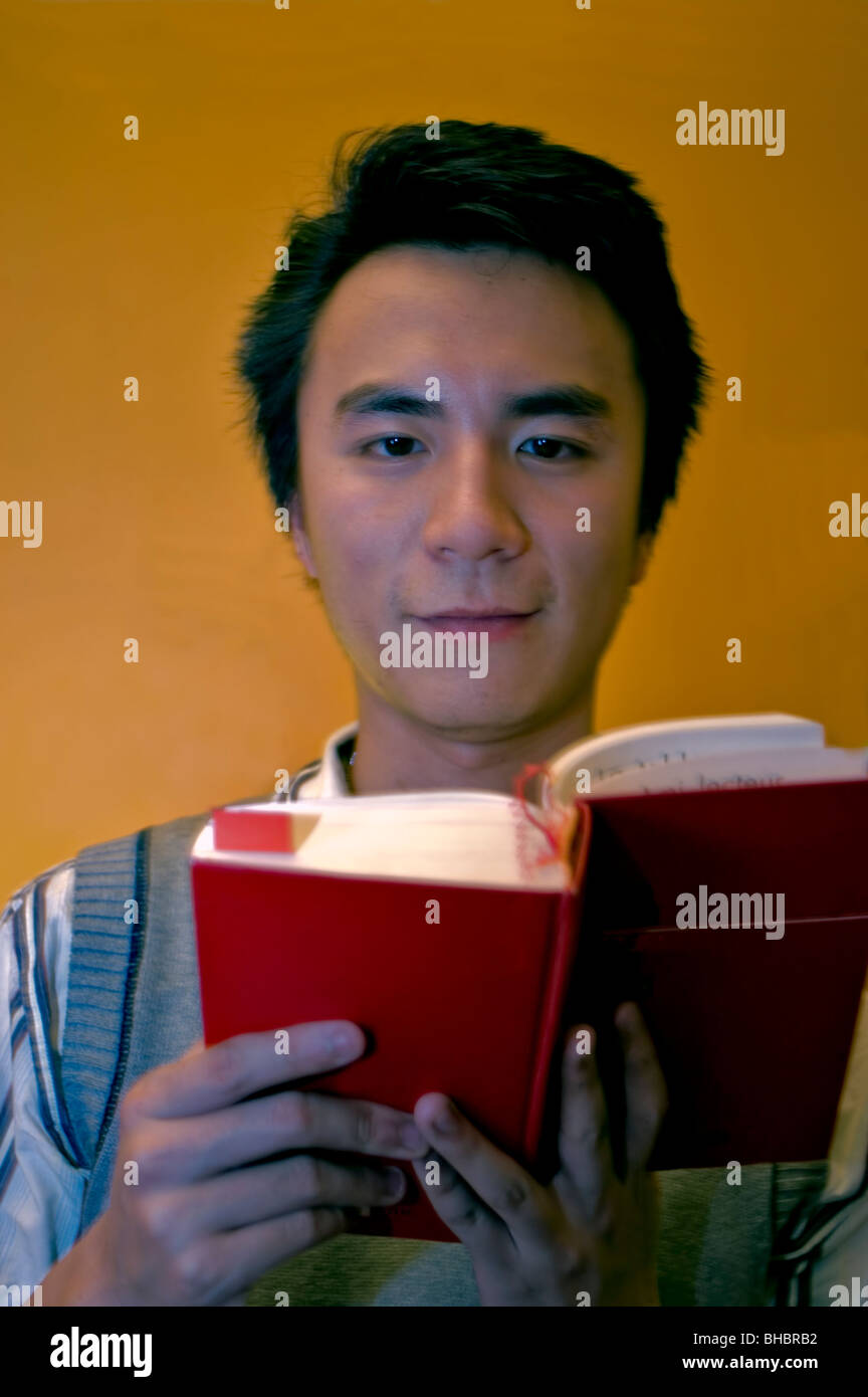 Portrait young Asian man Reading Tour Book in Medium Shot, Diverse ...