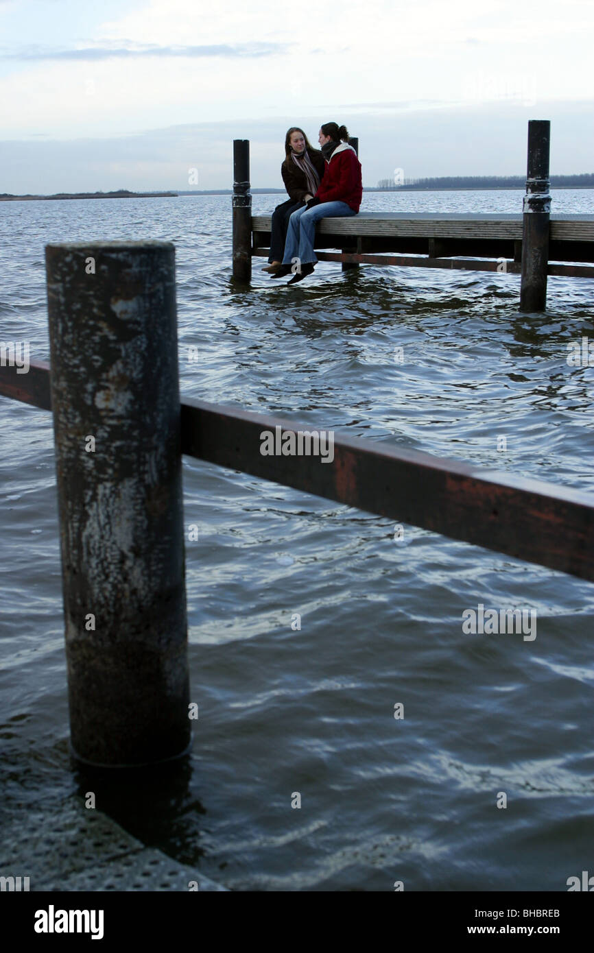 Two ladies talking on beach hi-res stock photography and images - Alamy