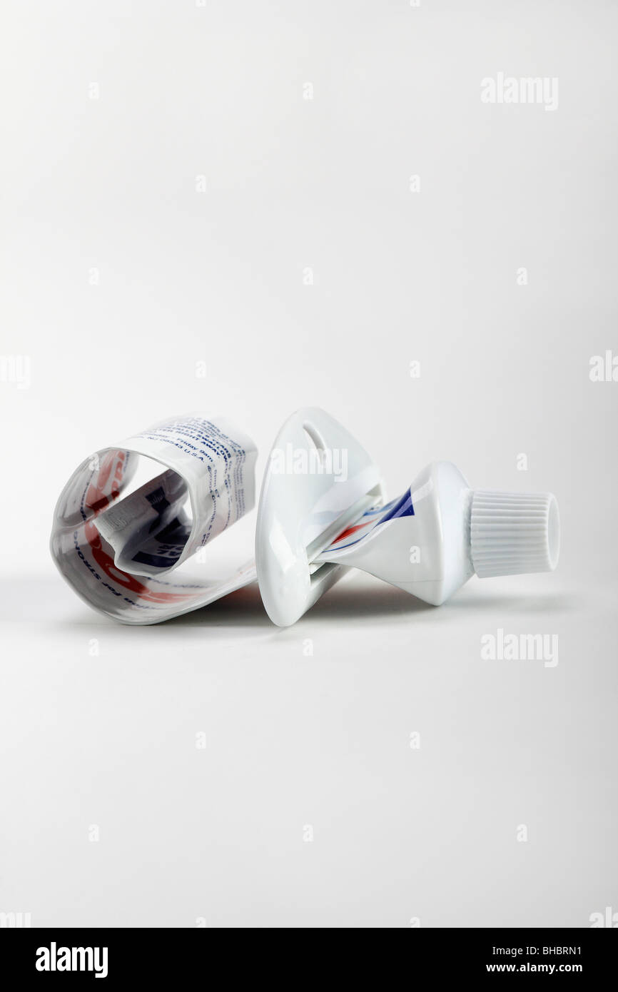 Toothpaste with a squeezer dispenser empty tube cut out cutout isolated ...